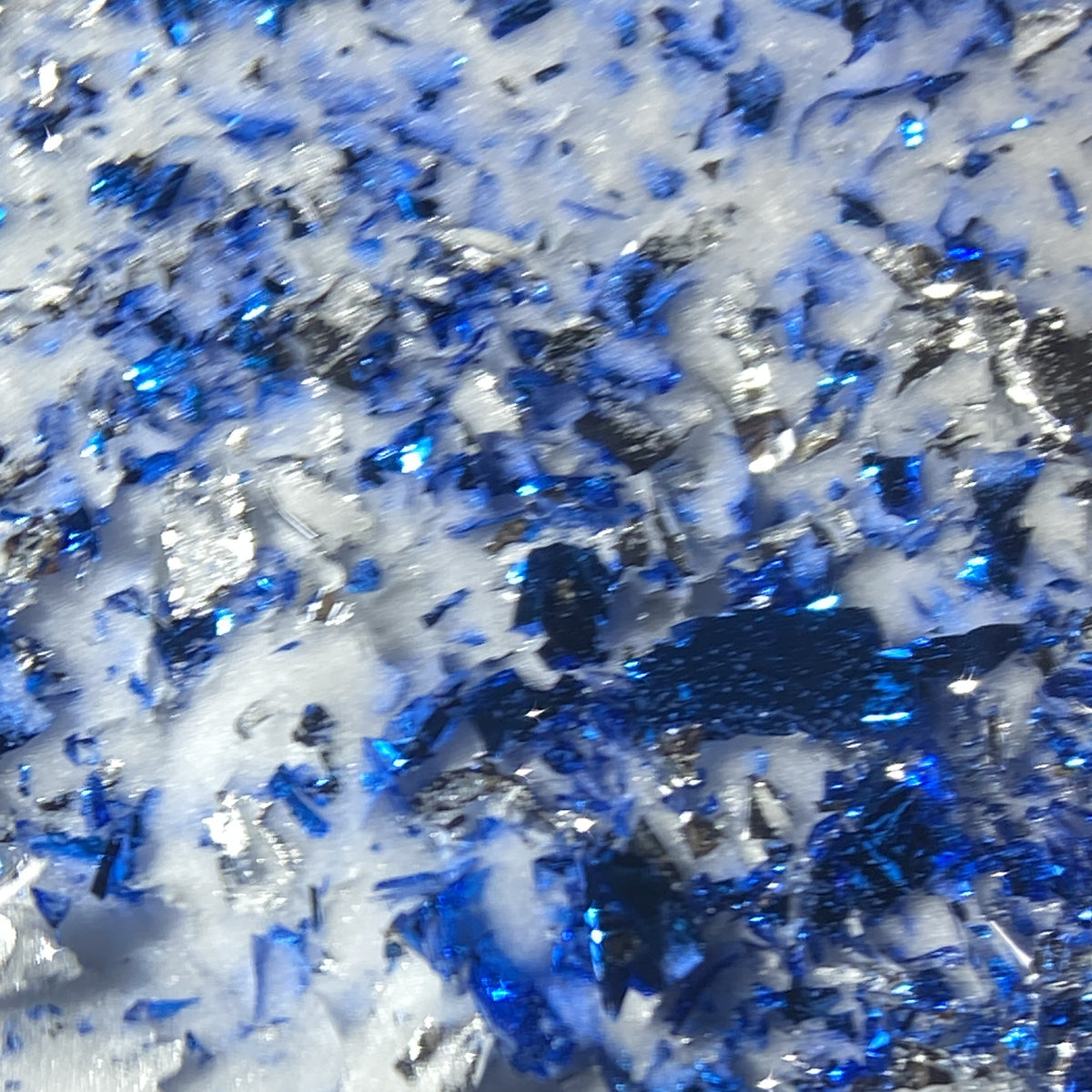 A clear-based formula featuring a high-density mix of irregular ...